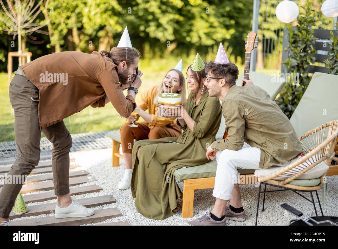 Friends having fun celebrating birthday party outdoors Stock Photo - Alamy