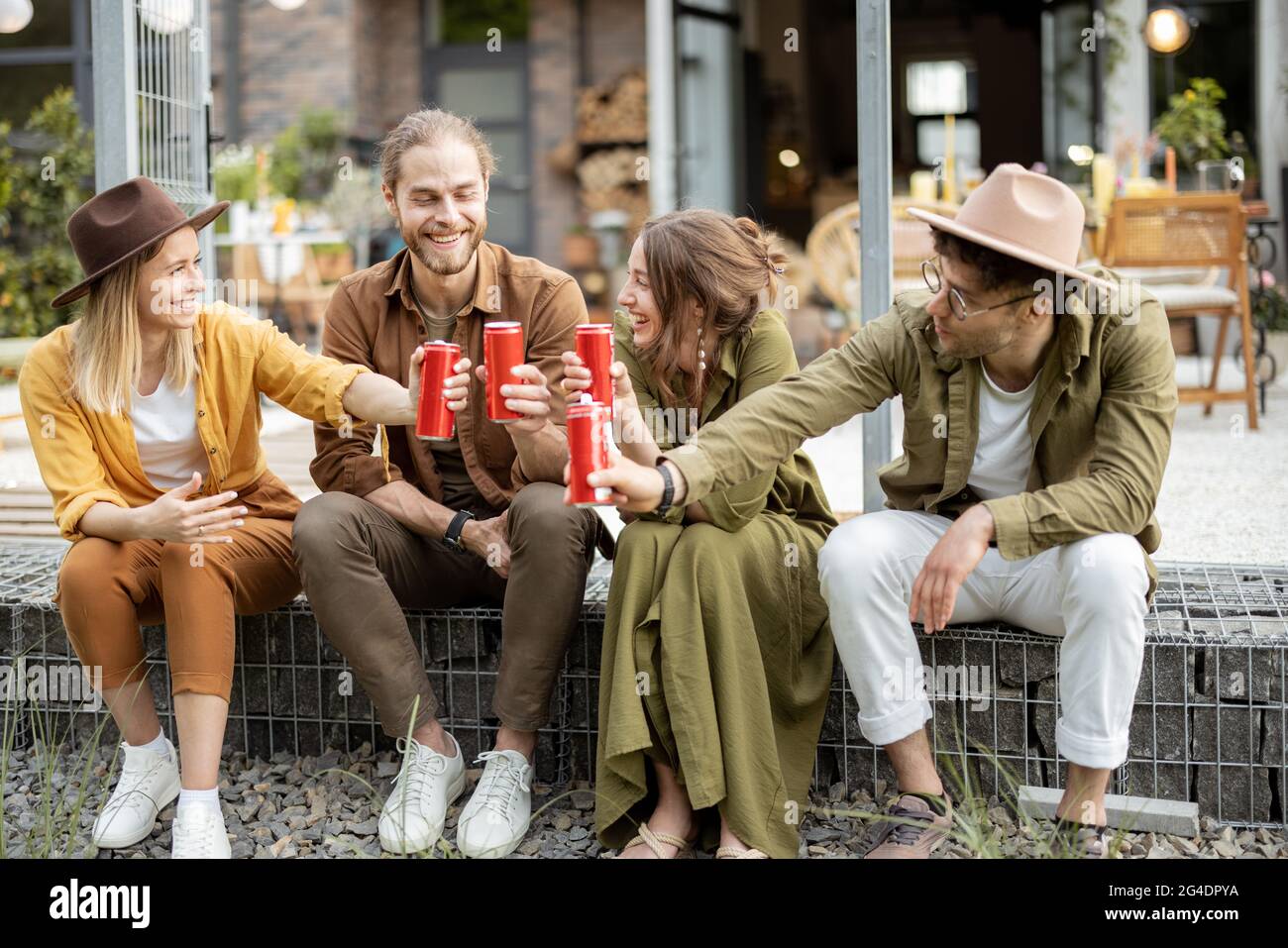 Friends gathering together on a porch of a country house Stock Photo ...
