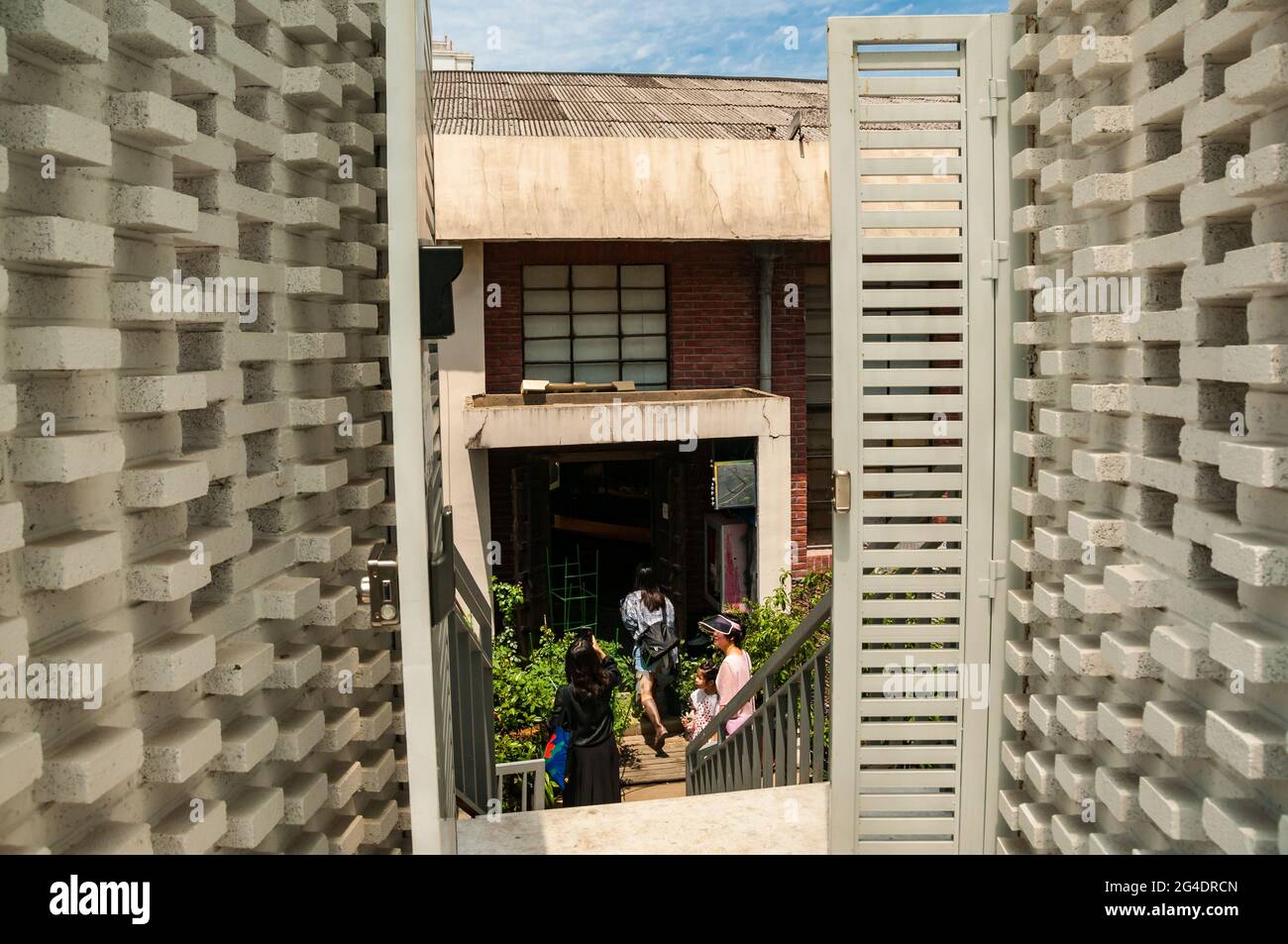 Visitors entering a gallery in the M50 art district seen from a terrace ...