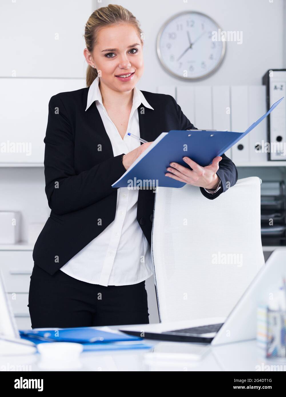 Secretary writing instructions Stock Photo - Alamy