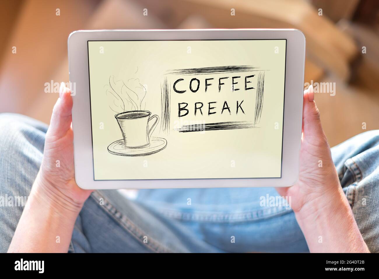 Tablet screen displaying a coffee break concept Stock Photo - Alamy