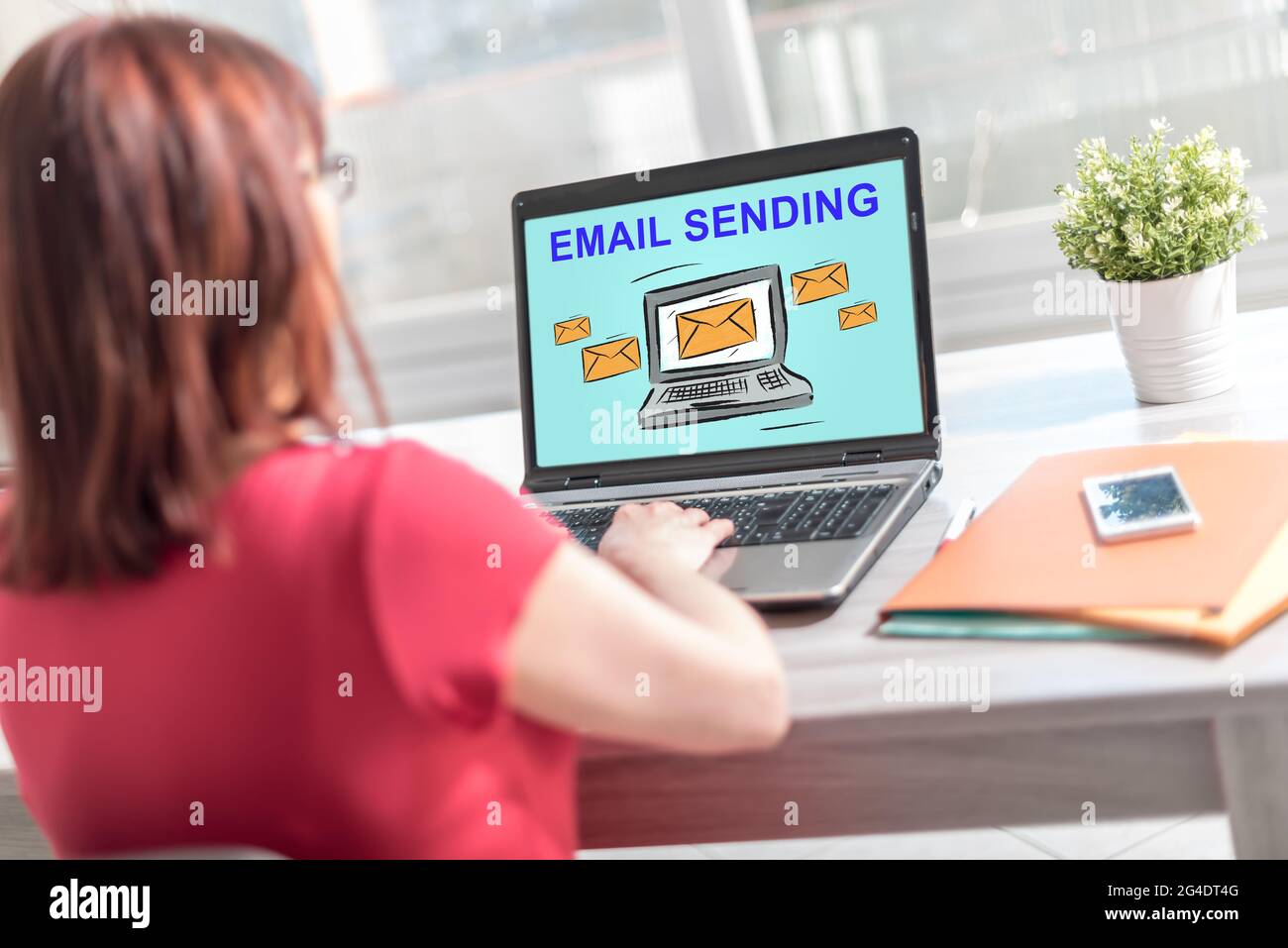 Laptop screen displaying an email sending concept Stock Photo - Alamy