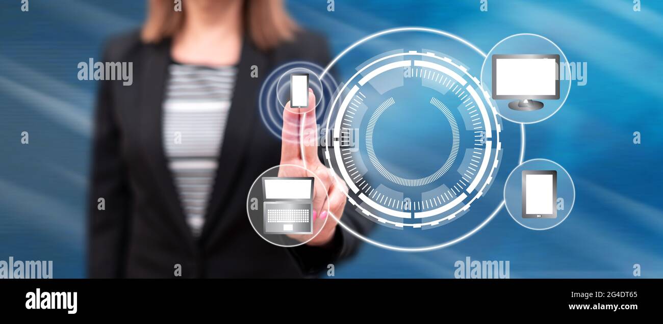 Woman touching a device connection concept on a touch screen with her ...