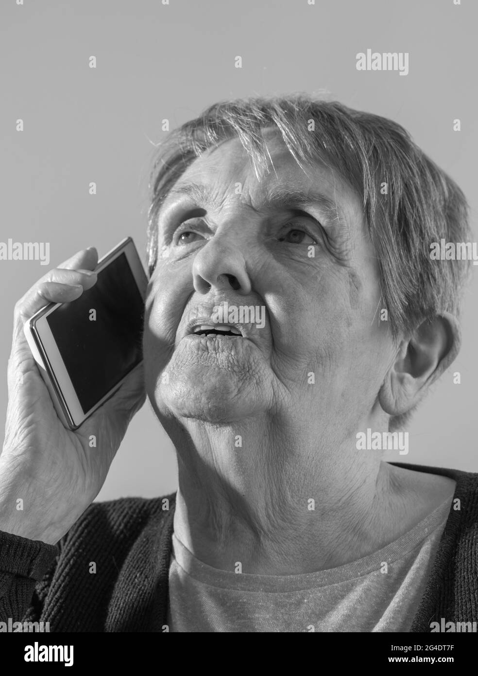 Elderly person using Black and White Stock Photos & Images - Alamy