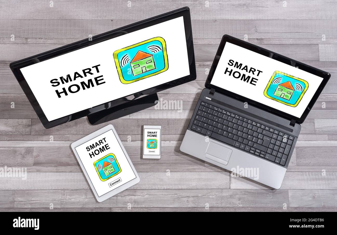 Smart home concept shown on different information technology devices ...