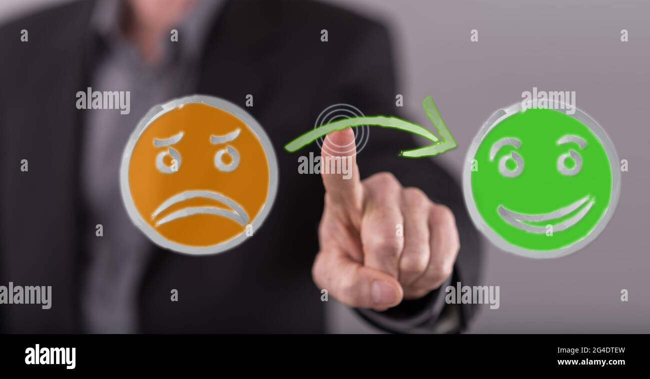 Man touching a customer satisfaction concept on a touch screen with his ...