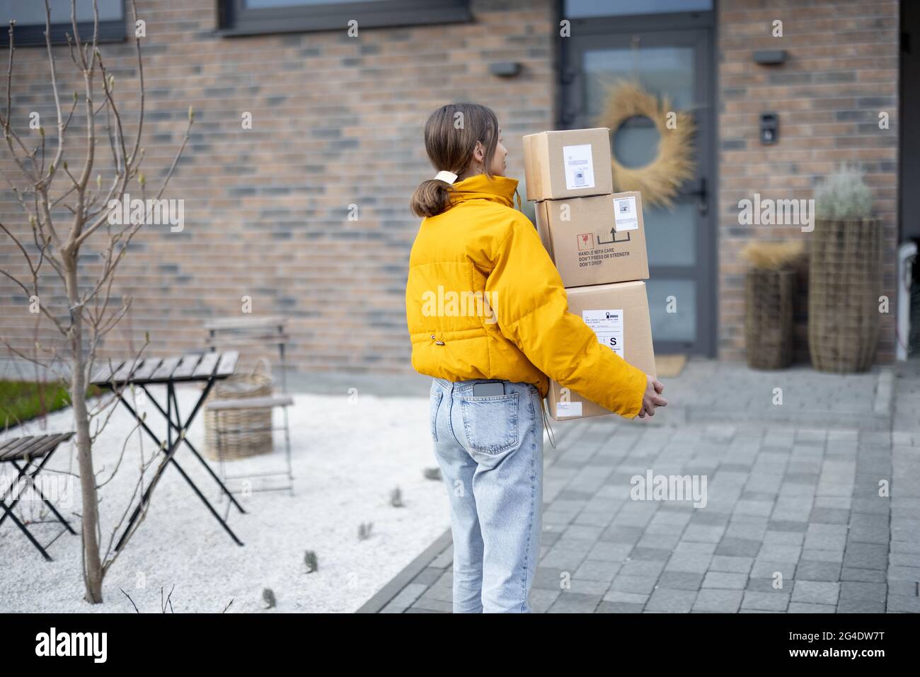 Woman coming home hi-res stock photography and images - Alamy