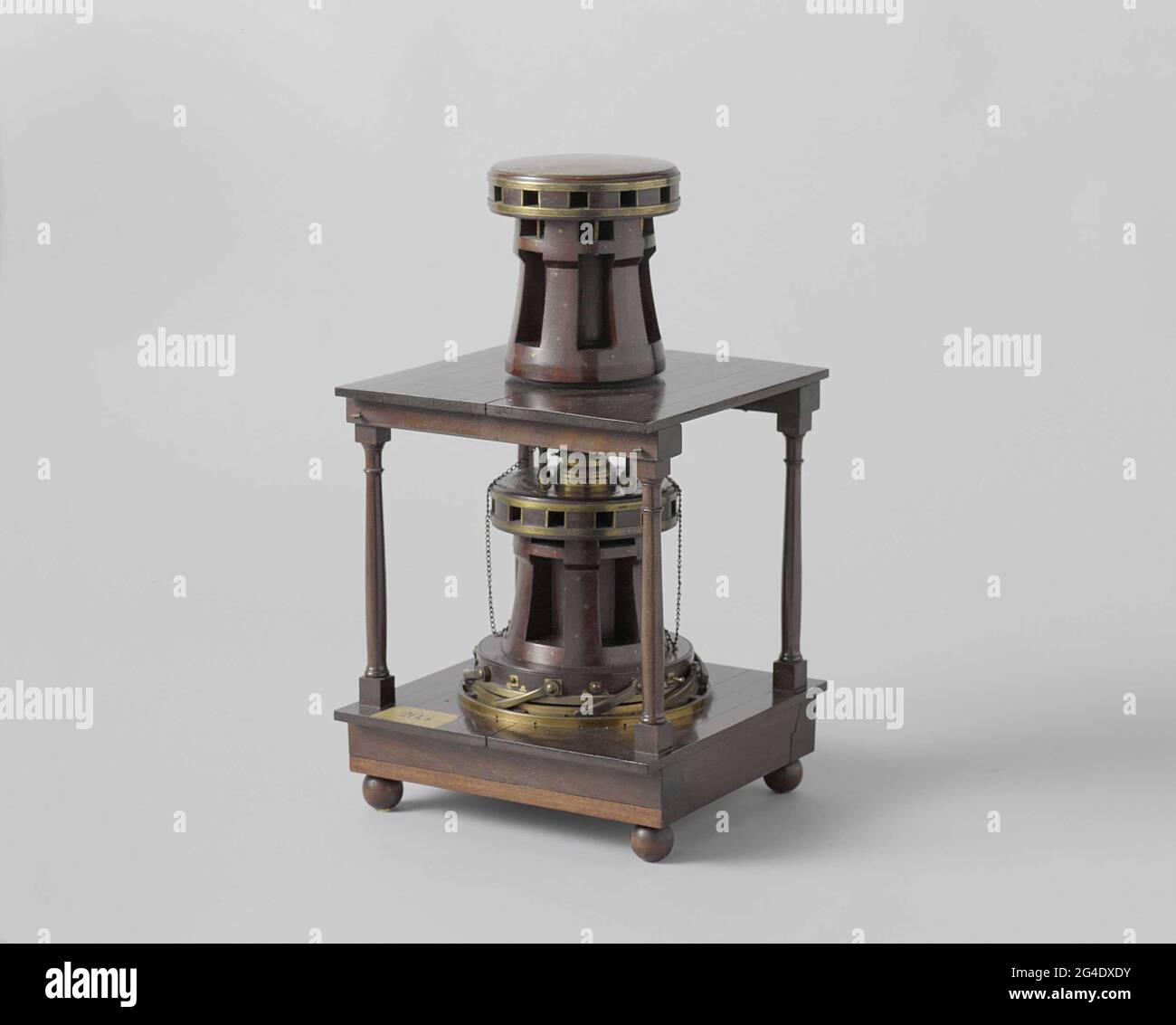 . Model of a double capstan in a wooden frame that represents two decks ...