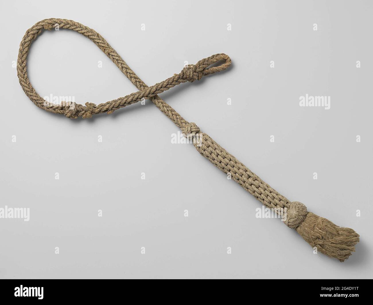 . Bed cord has been knotted with four wires. At the top of a knotted ...