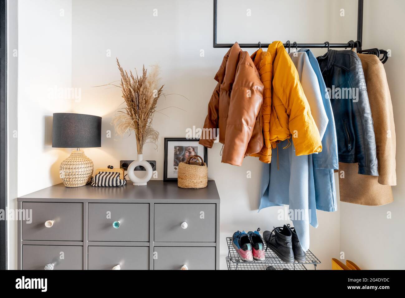 House hallway interior with clothes and furniture Stock Photo - Alamy