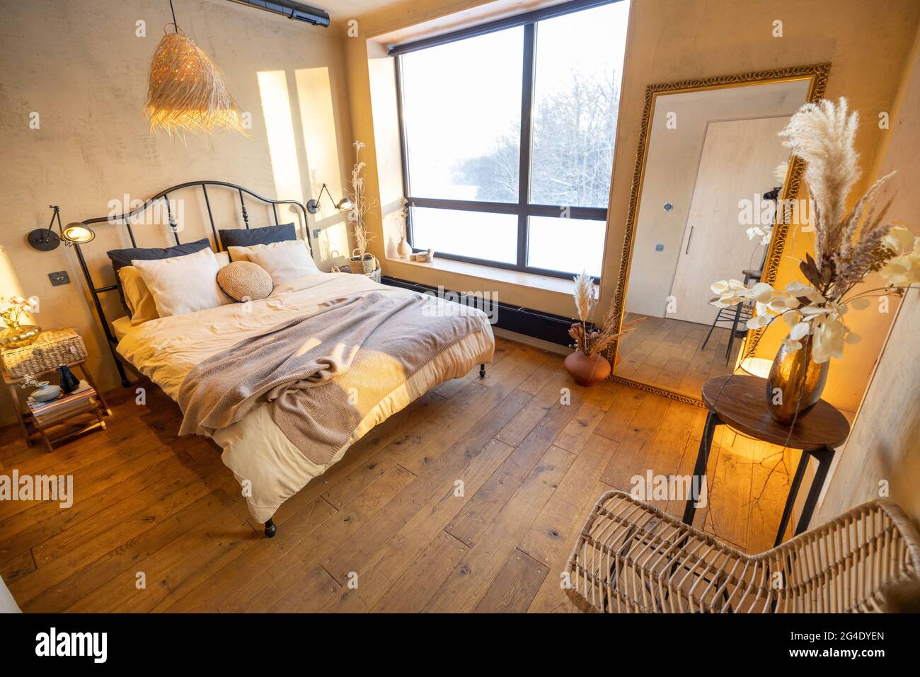 Stylish bedroom interior in natural boho style Stock Photo - Alamy