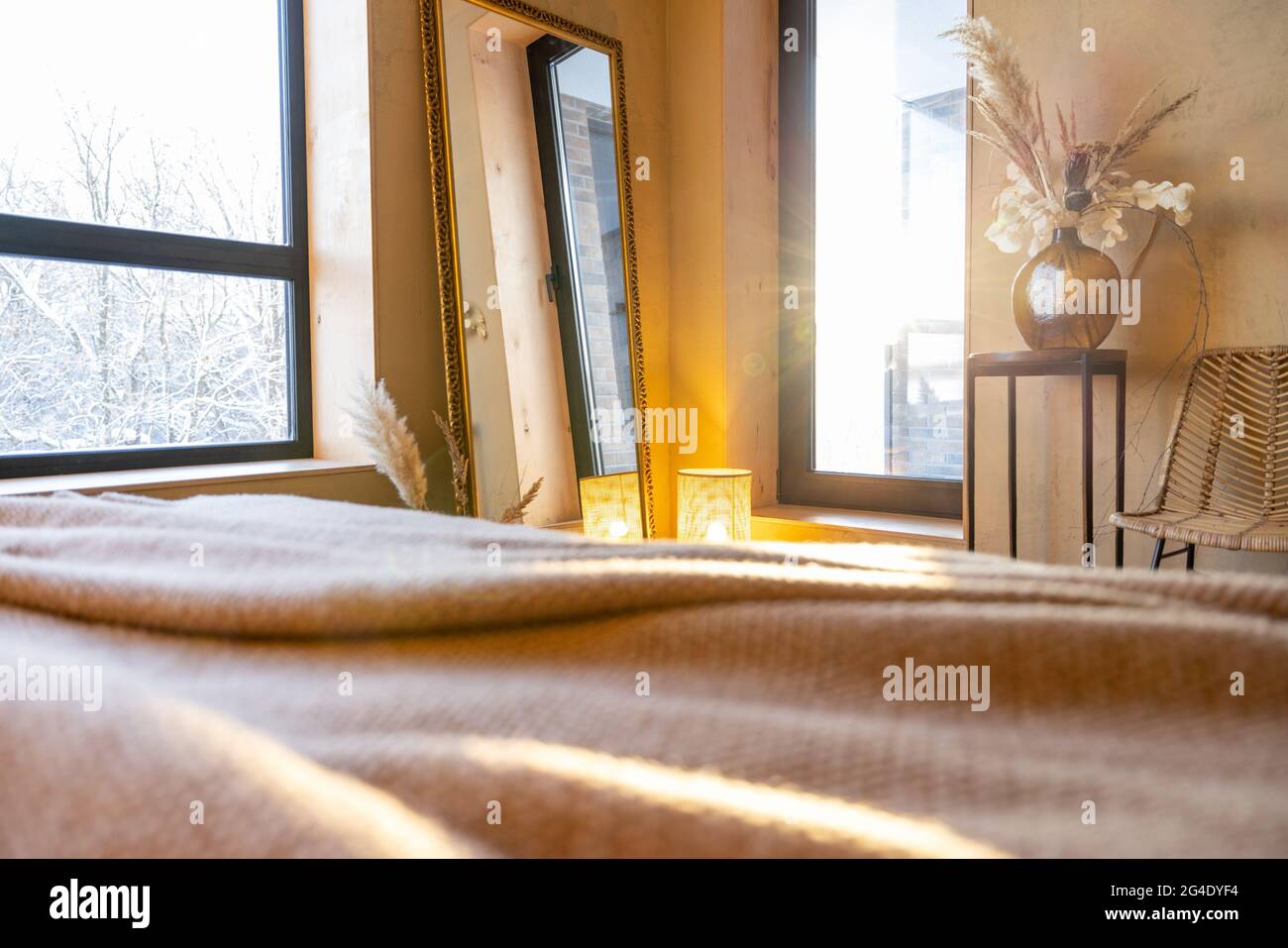 Stylish bedroom interior in natural boho style Stock Photo - Alamy
