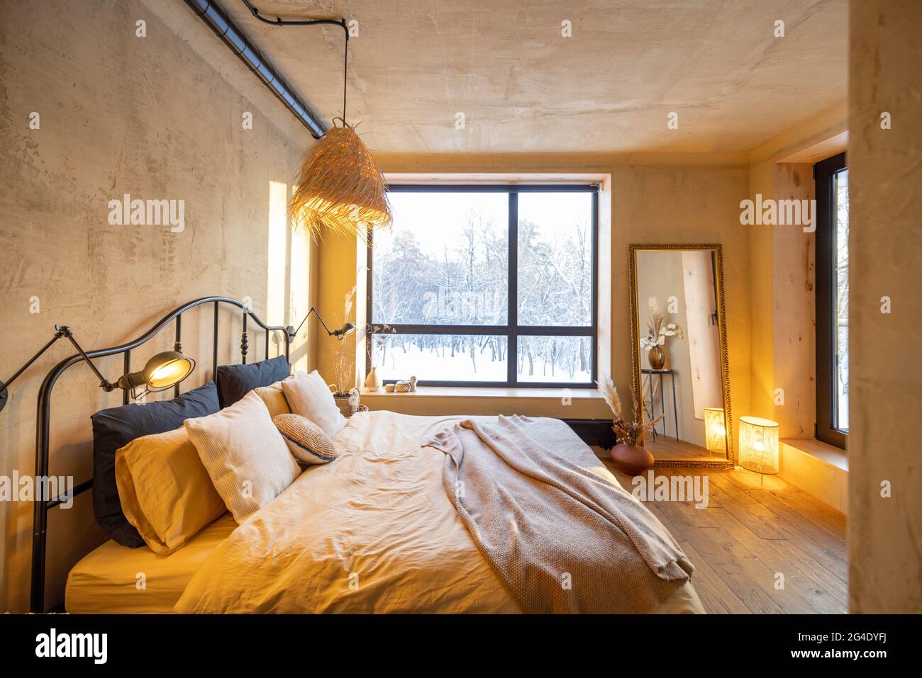 Stylish bedroom interior in natural boho style Stock Photo - Alamy