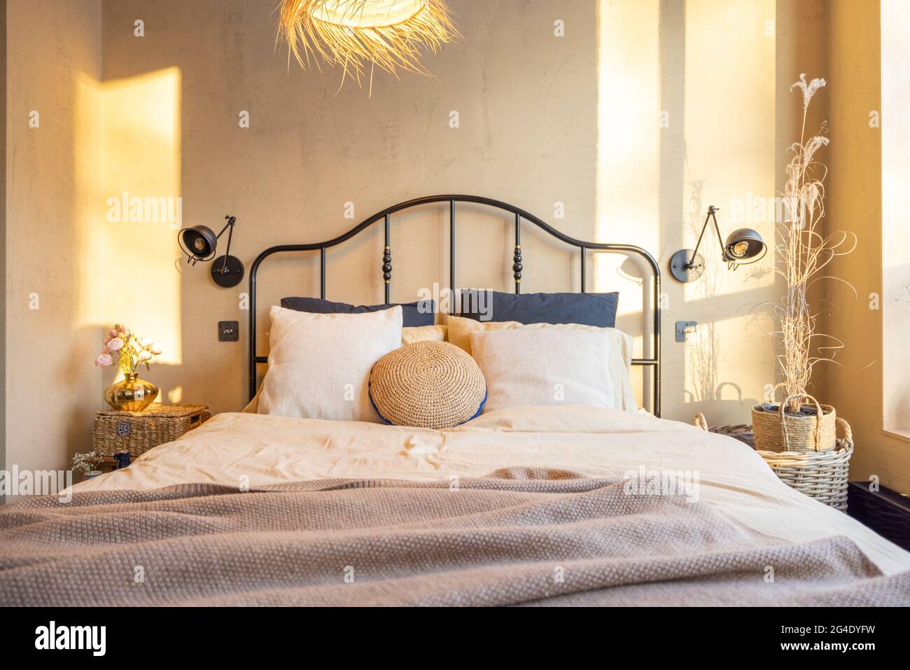 Stylish bedroom interior in natural boho style Stock Photo - Alamy