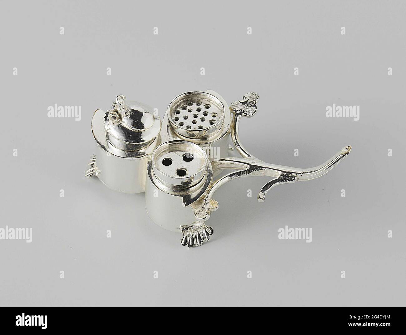 . Ink set in the shape of a branch. The ink set stands on three legs ...