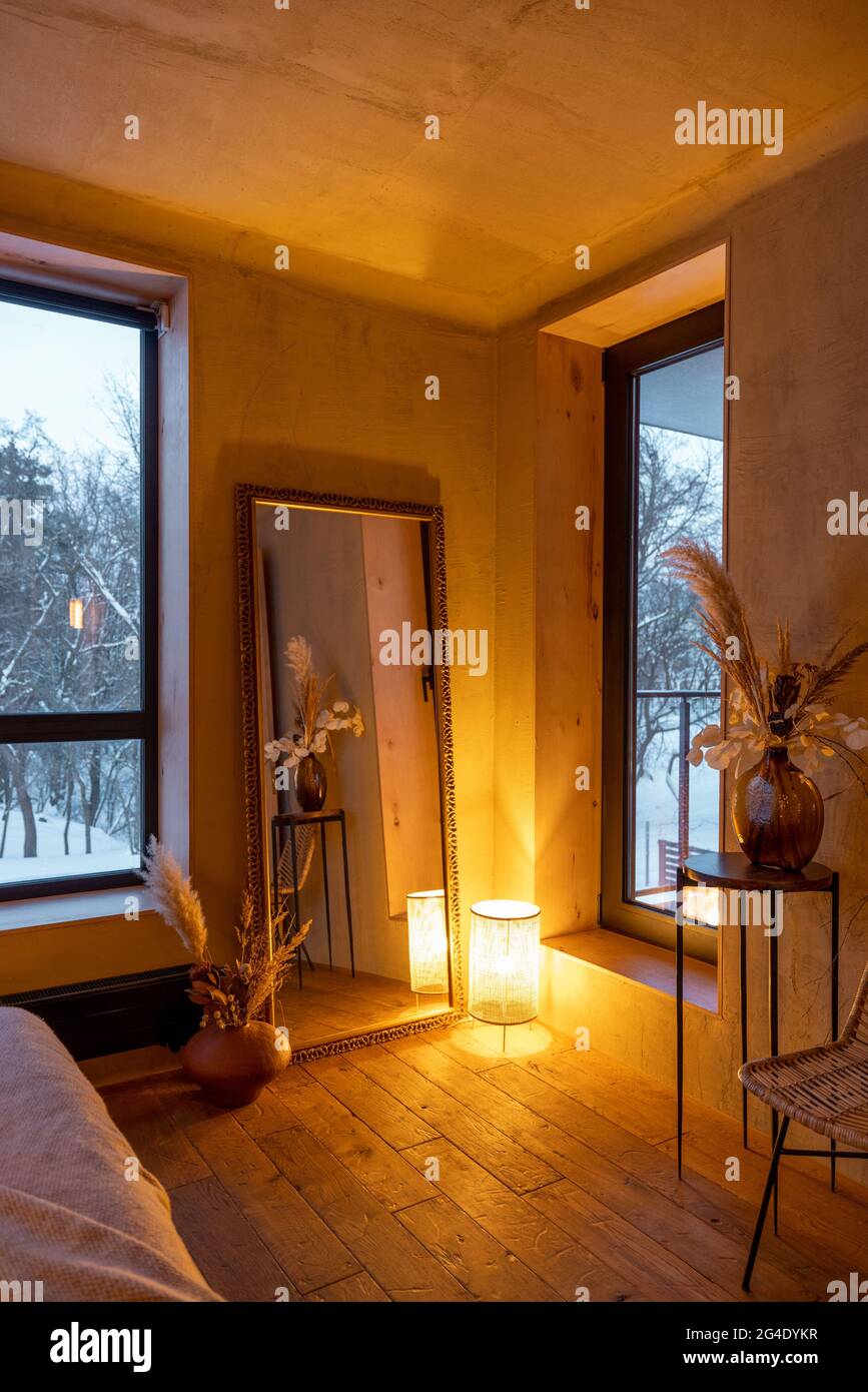 Stylish bedroom interior in natural boho style Stock Photo - Alamy