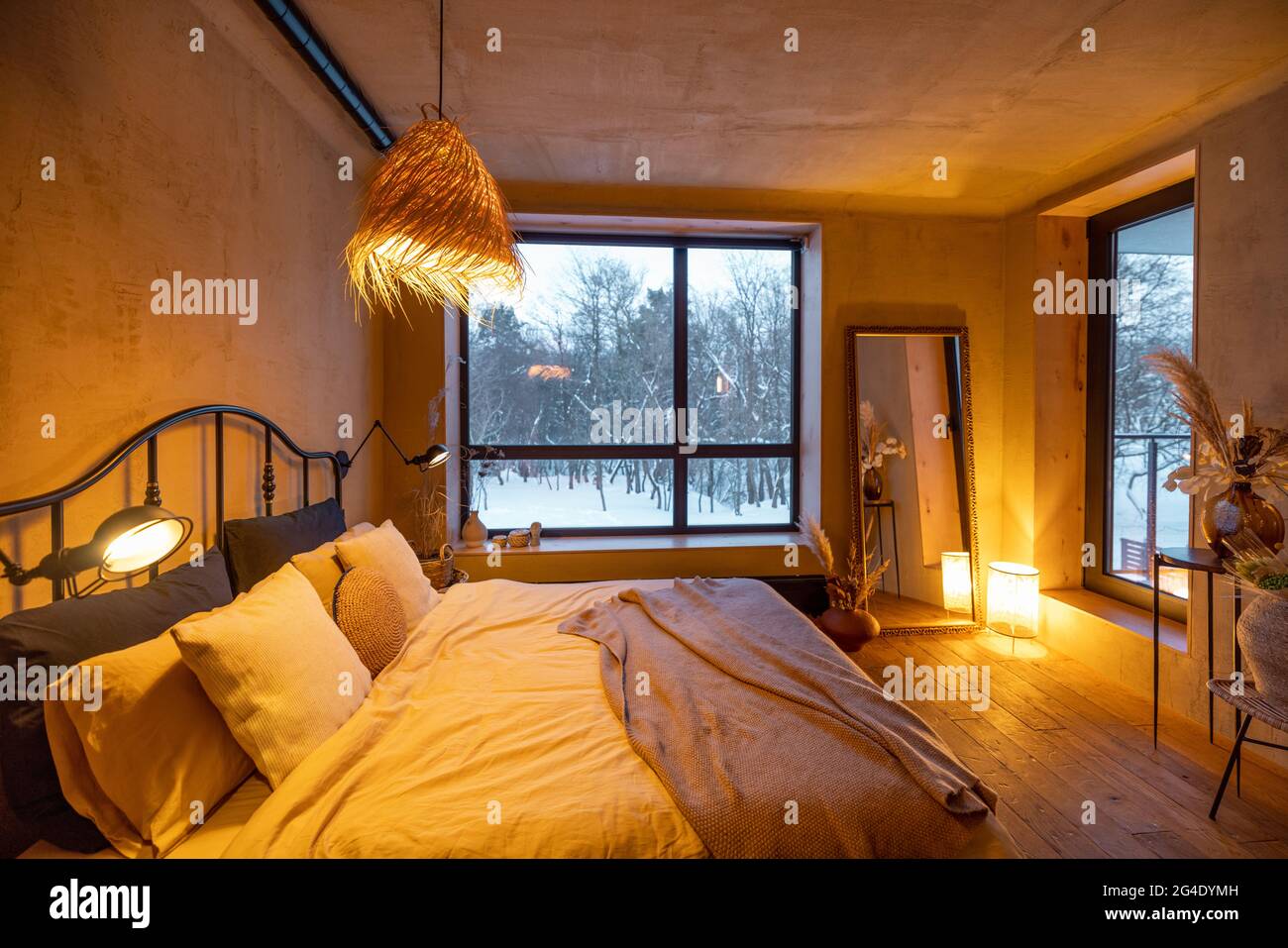 Stylish bedroom interior in natural boho style Stock Photo - Alamy