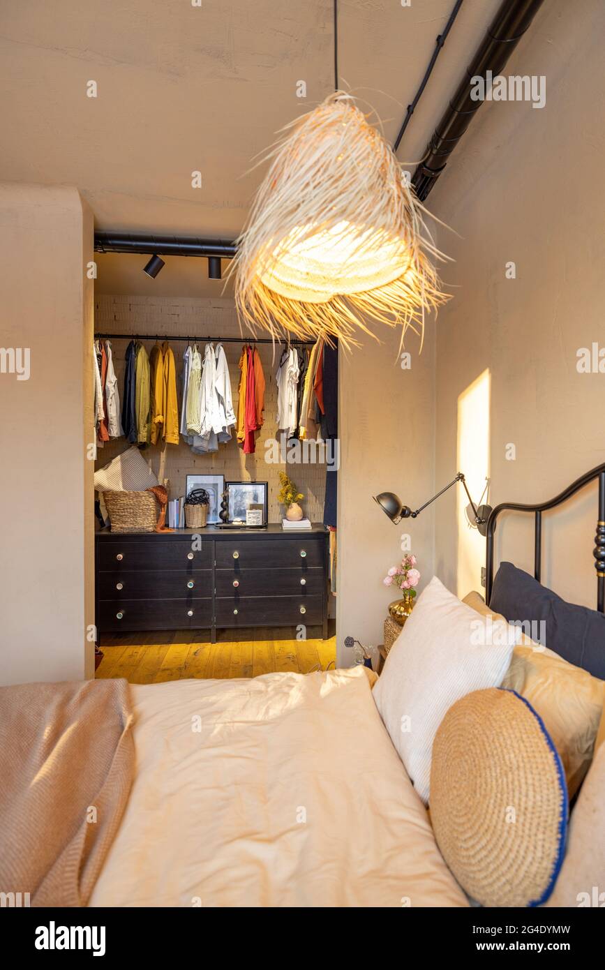 Stylish bedroom interior in natural boho style Stock Photo - Alamy