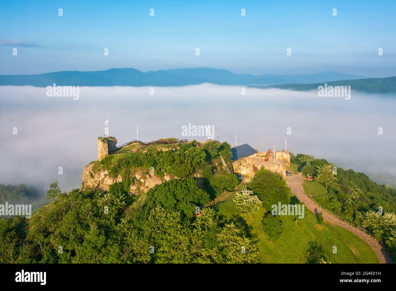 Aerial view about castle of Sirok with misty matra mountains at the ...