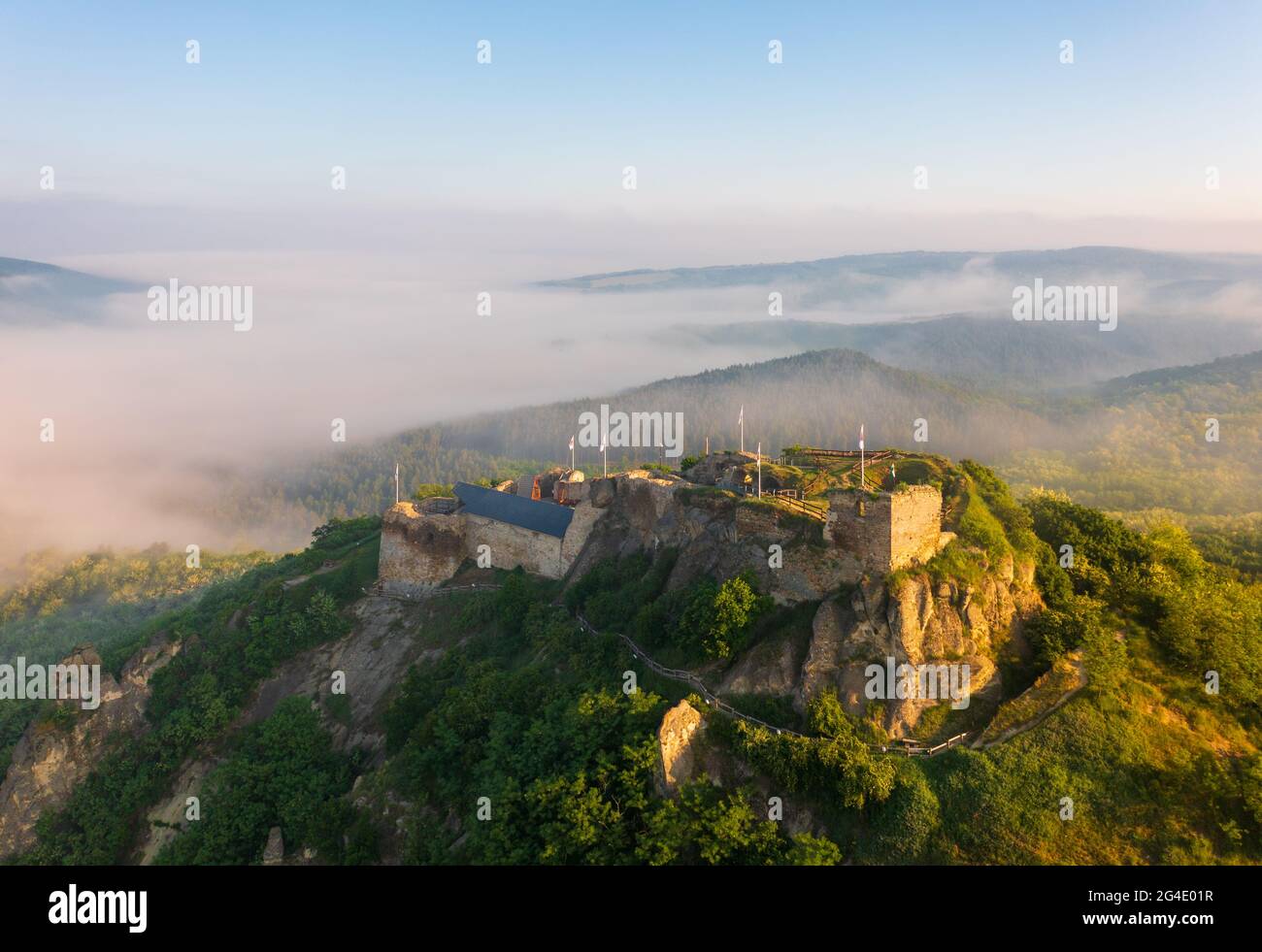 Aerial view about castle of Sirok with misty matra mountains at the ...