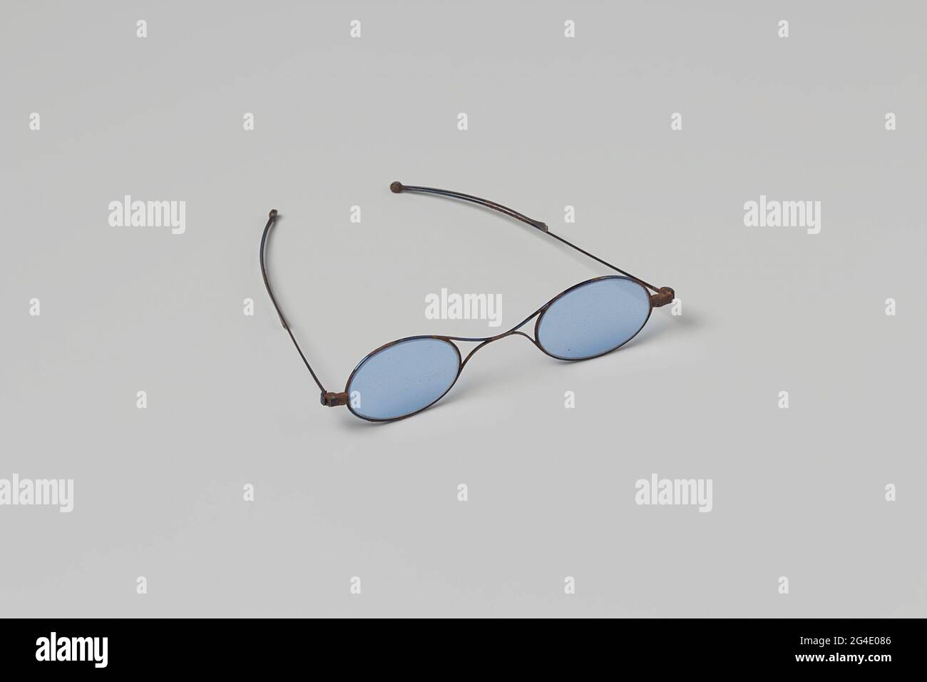 Glasses of blue steel with oval blue spectacles. Glasses with oval blue ...