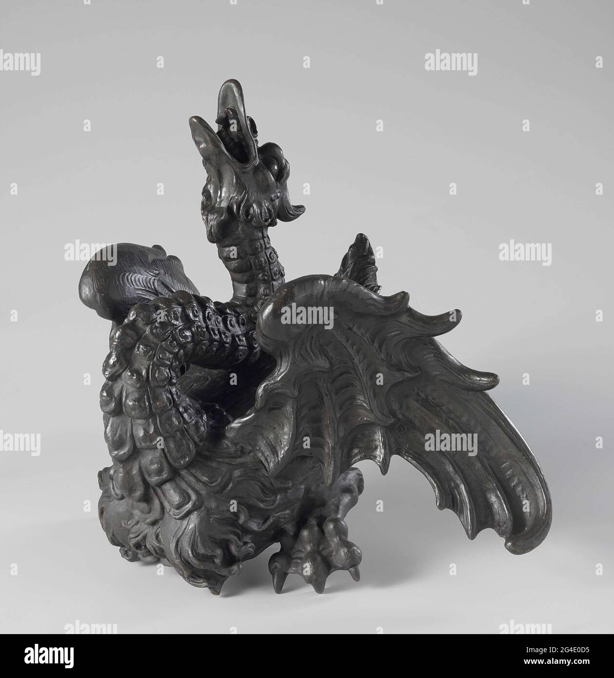 . Dragon, which simplified with a thrown head and scalyed neck rests on ...