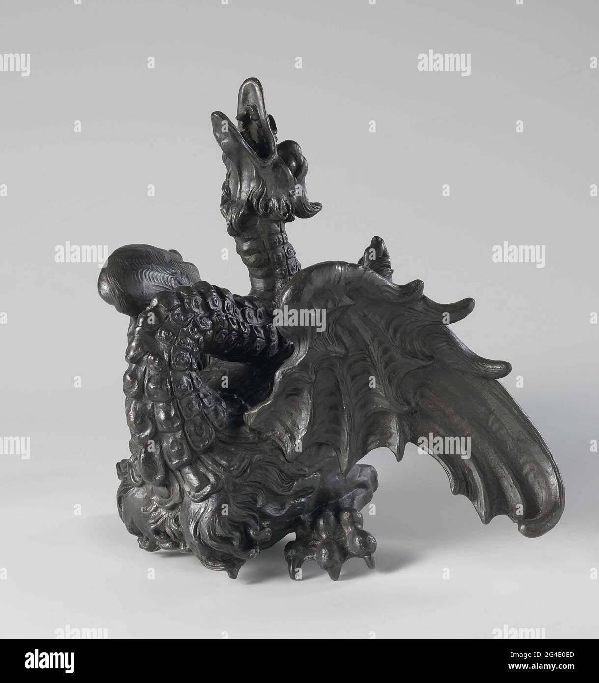 . Dragon, which simplified with a thrown head and scalyed neck rests on ...