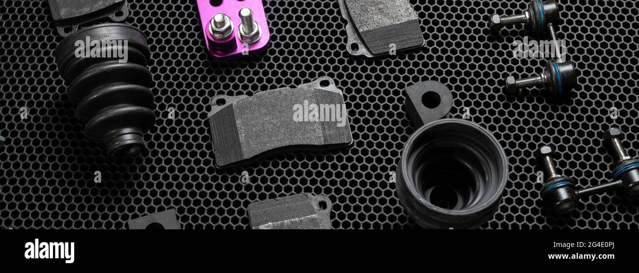 new car spare parts collection flat lay on dark background, change ...
