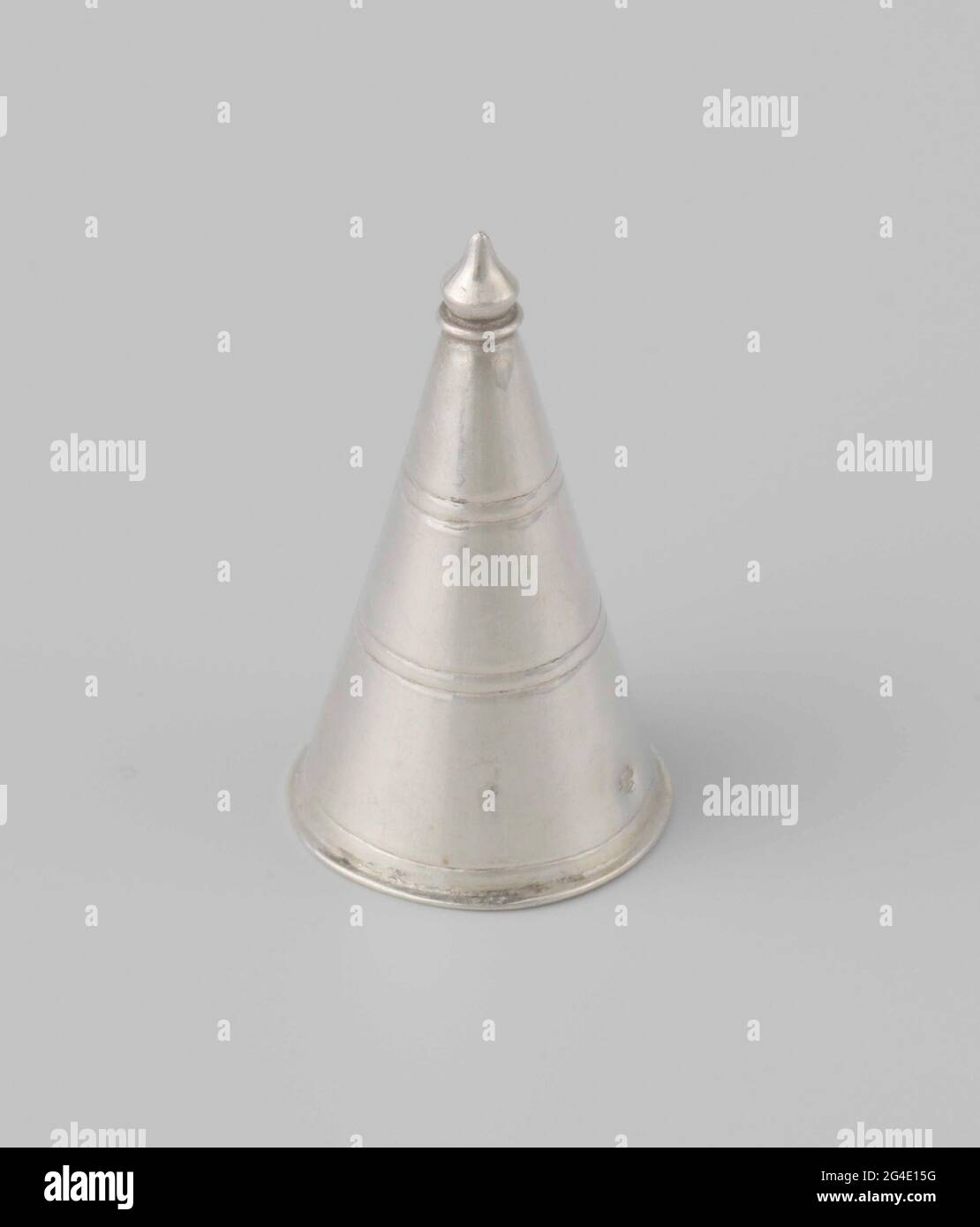 . Round, funnel-shaped damper with engraved rings. The edge of the ...