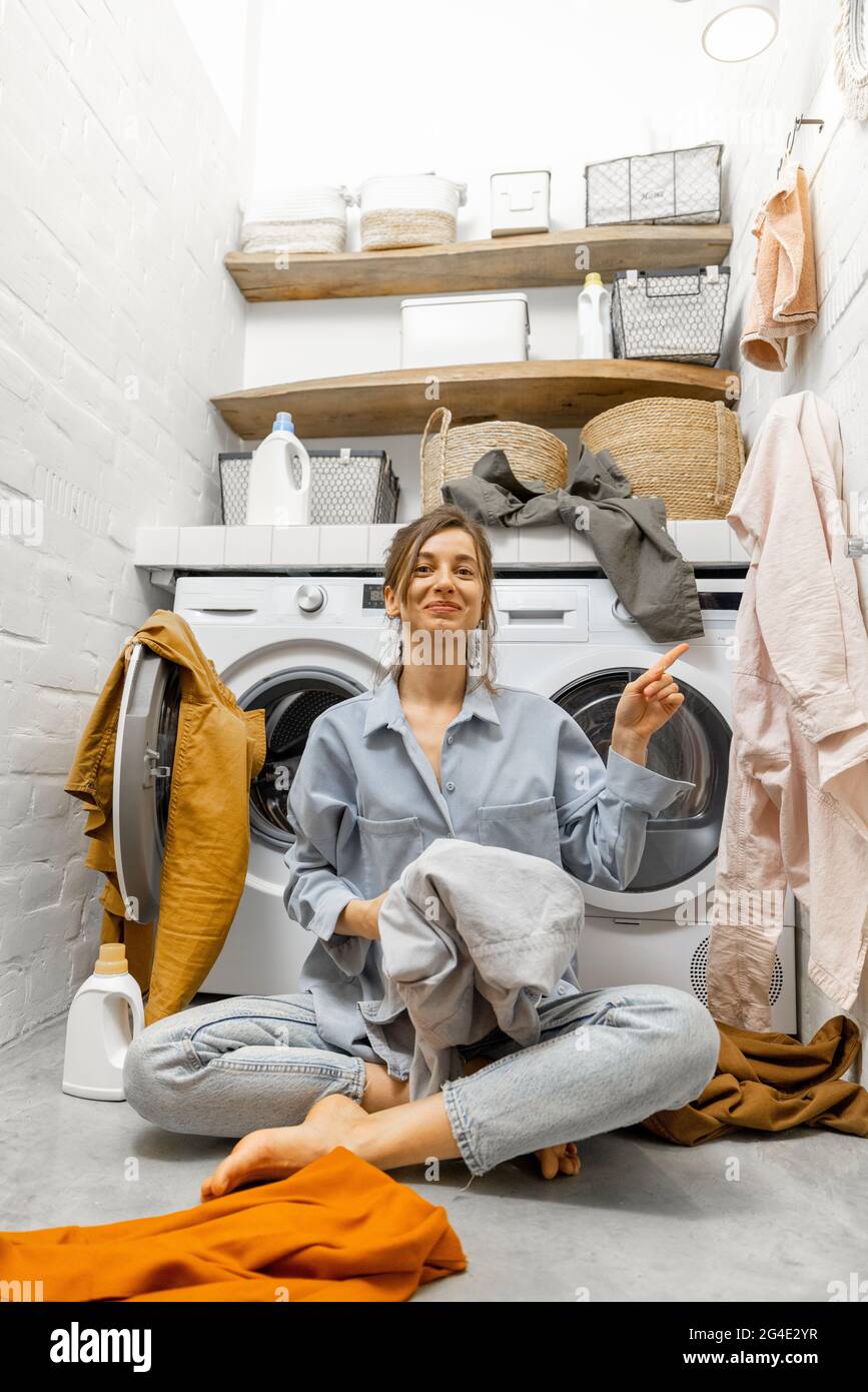 Happy housewife laundry washing machine hi-res stock photography and ...