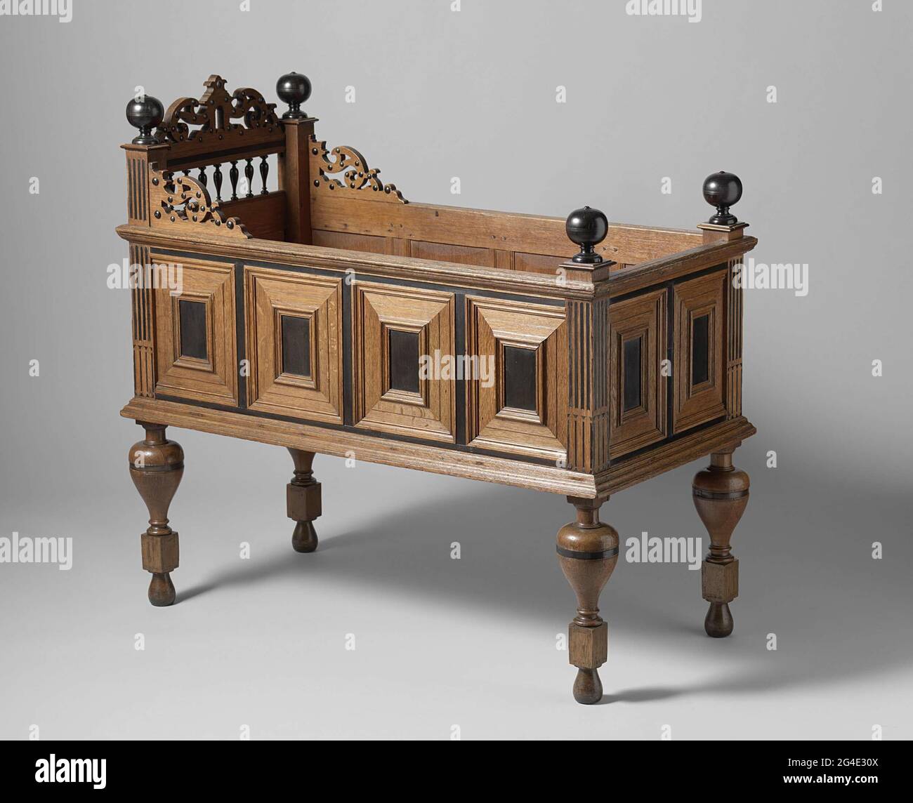 . The structure of this child’s cot is clear. The ebony marquetry ...