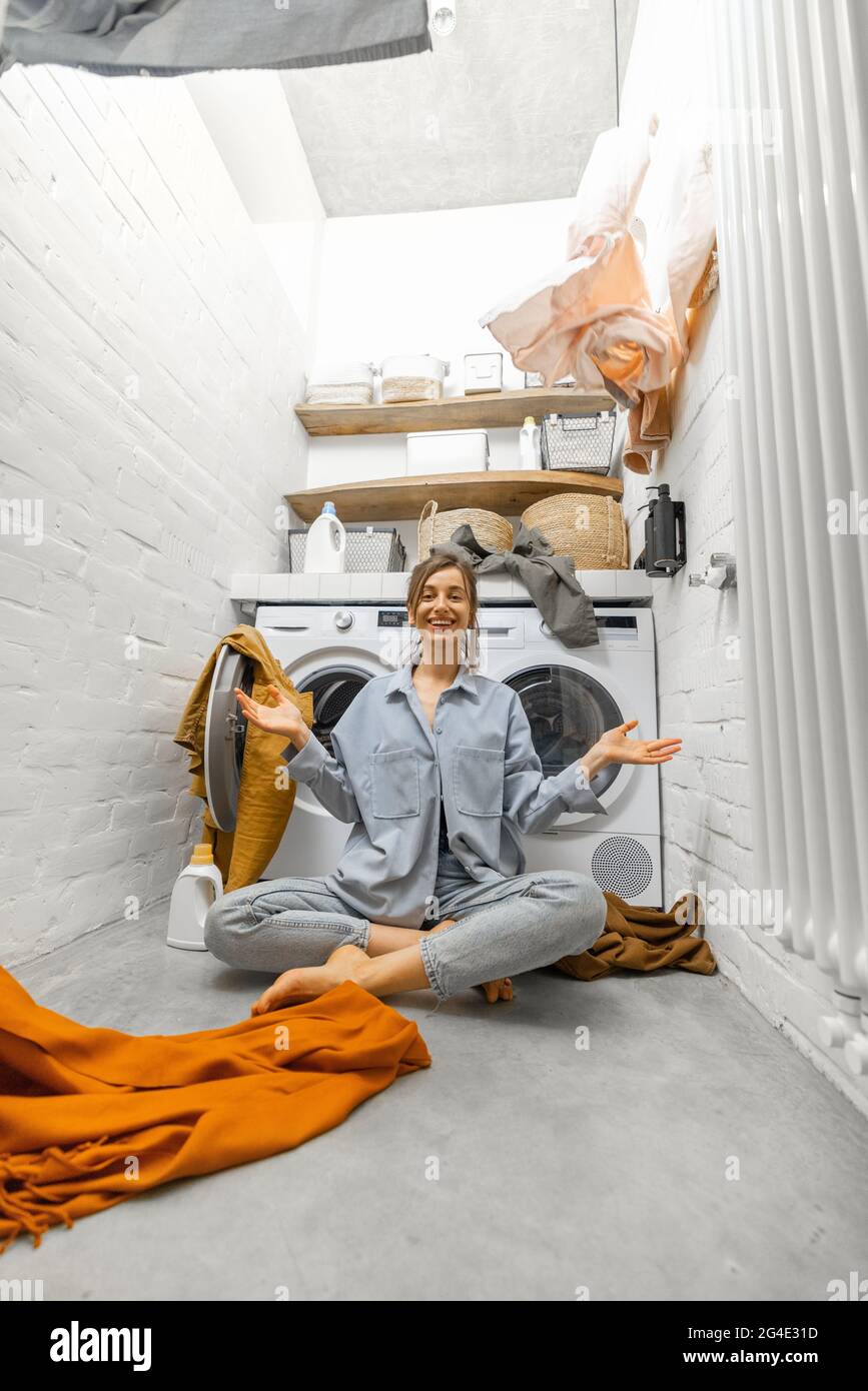 Happy housewife laundry washing machine hi-res stock photography and ...