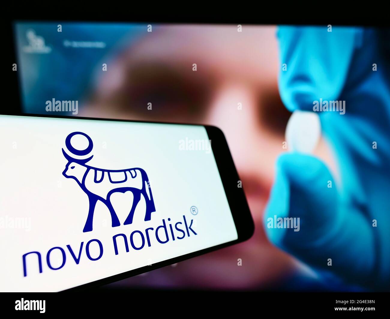 Mobile phone with logo of Danish pharmaceutical company Novo Nordisk AS ...