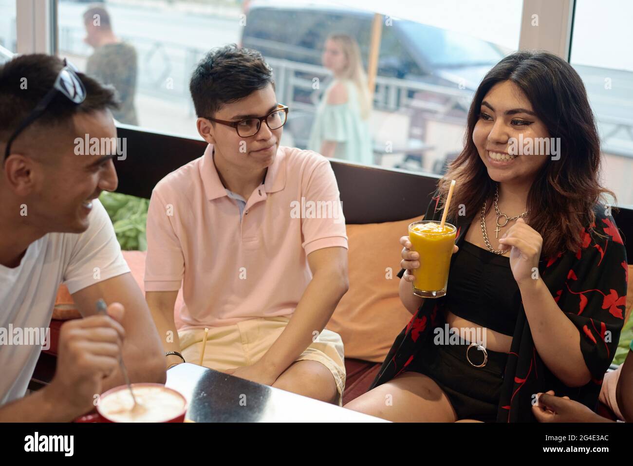 Multiracial happy young people drink coffee at cafe, black and white ...