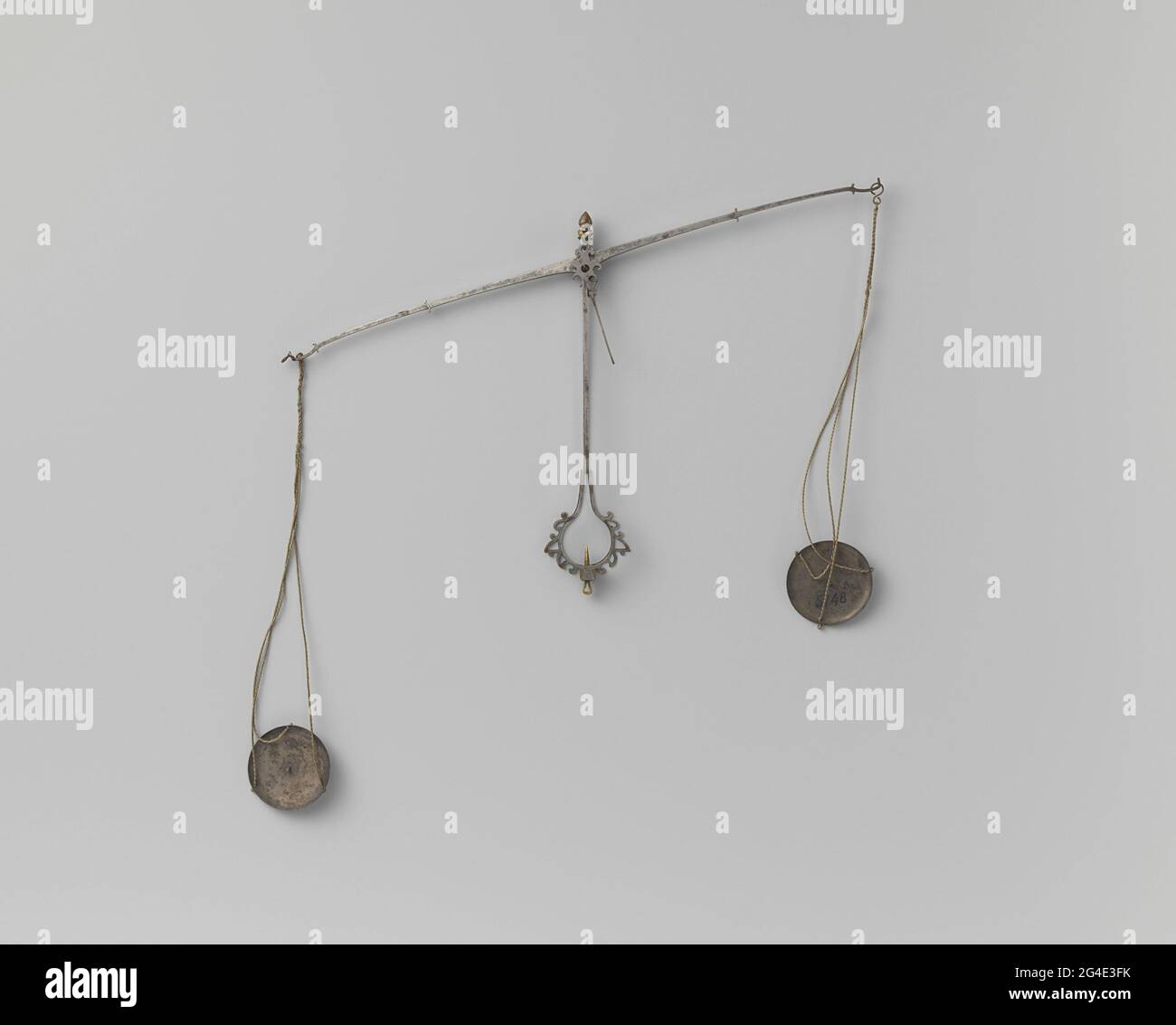 Gold balance. A gold balance with a silver scale Stock Photo - Alamy