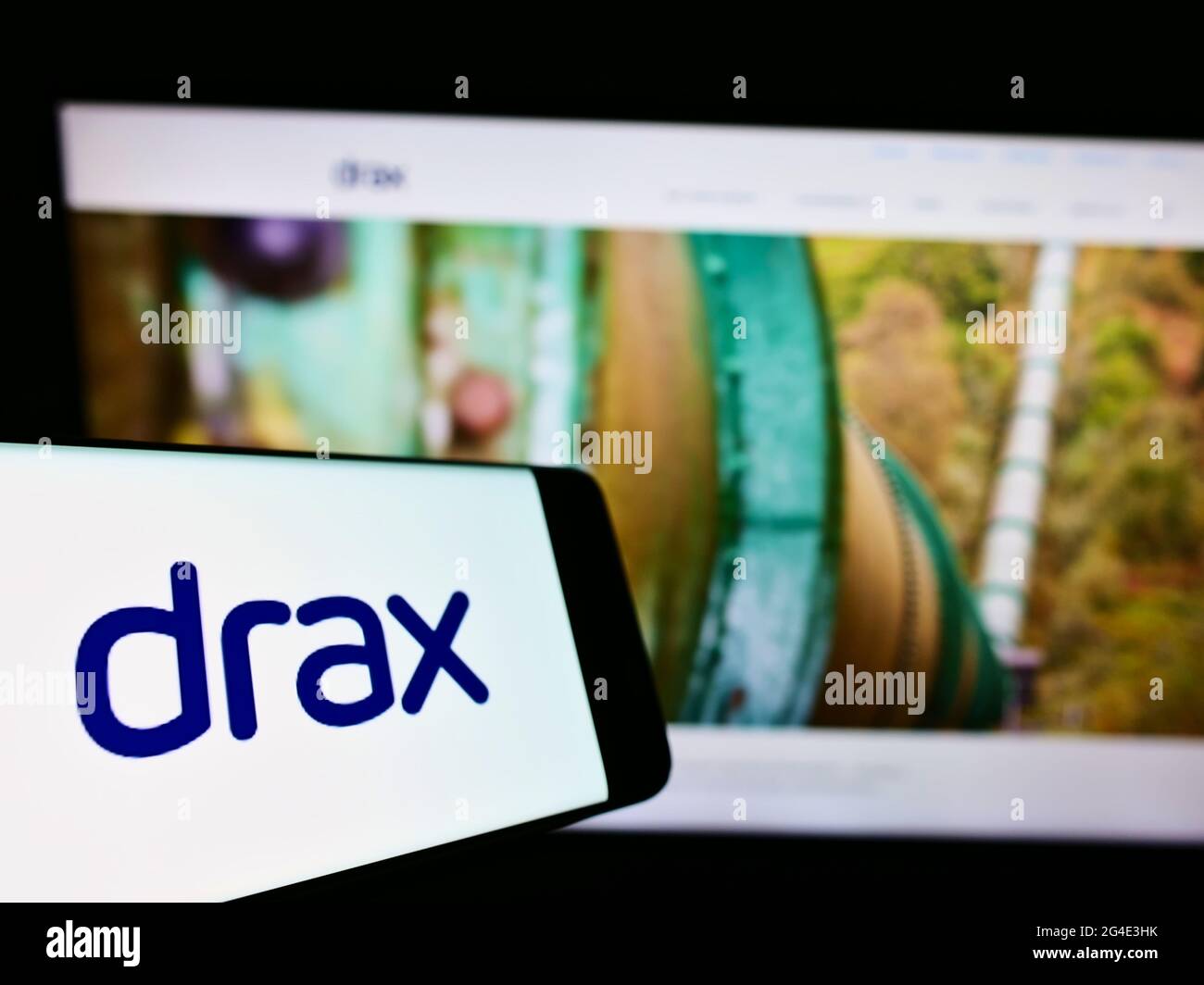 Cellphone with logo of British power company Drax Group plc on screen ...