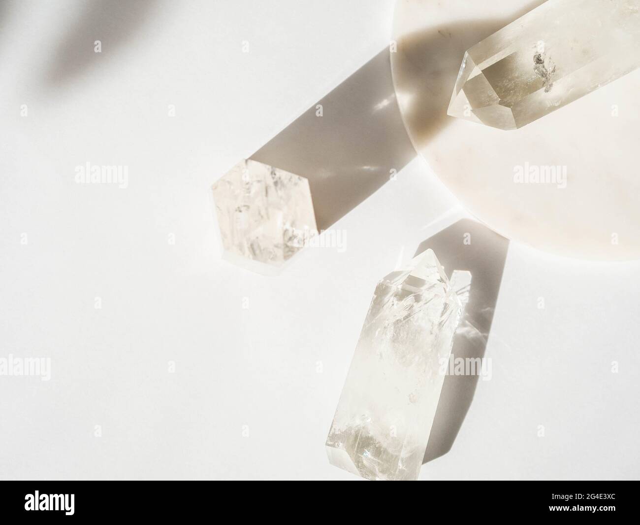 Collection of crystals quartz on a white background with shadows from ...