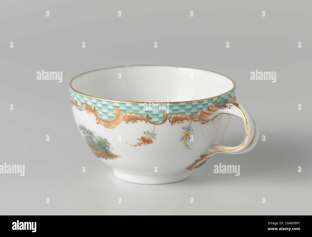 . Low cup with ear, painted porcelain. The head is painted with ...
