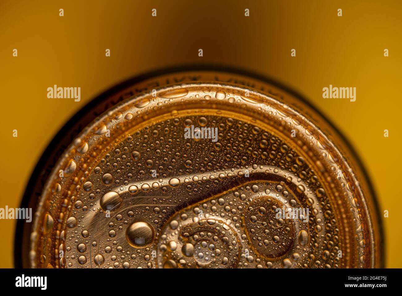 tin can of beer on a yellow background view from above Stock Photo - Alamy