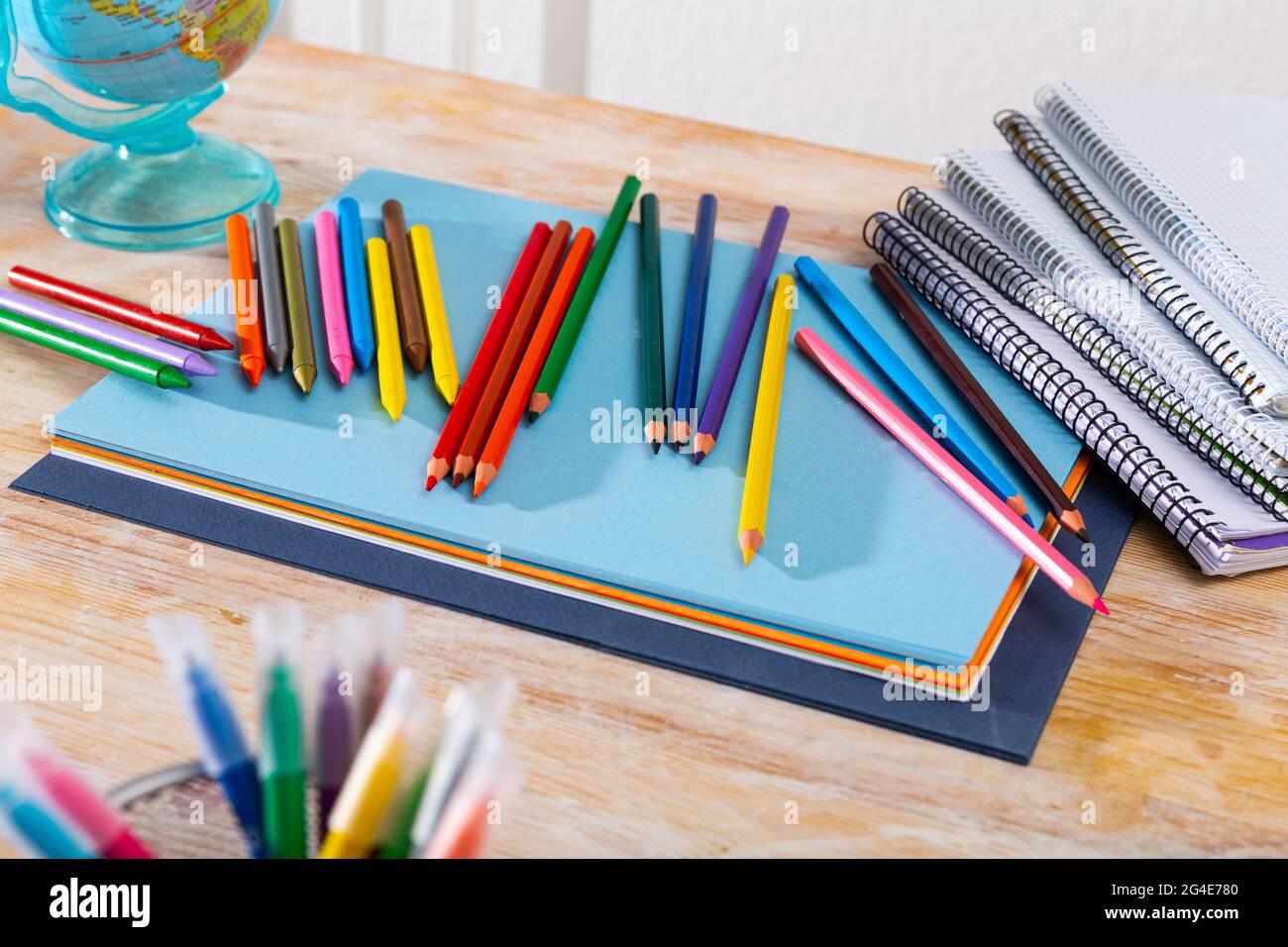 Colored pencils kept in pencil holder Stock Photo - Alamy