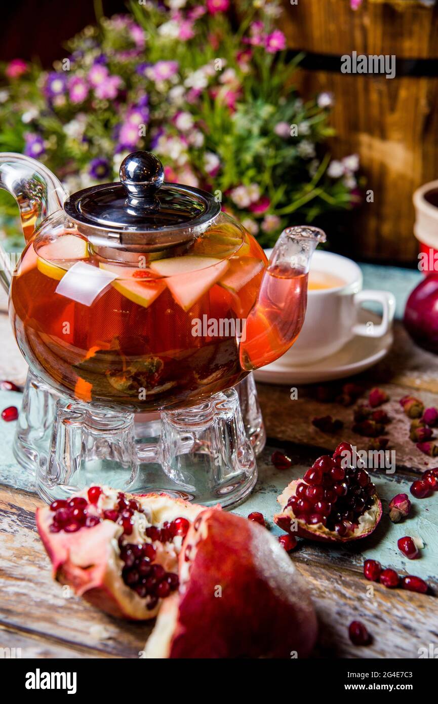 red fruit tea in a transparent teapot Stock Photo - Alamy
