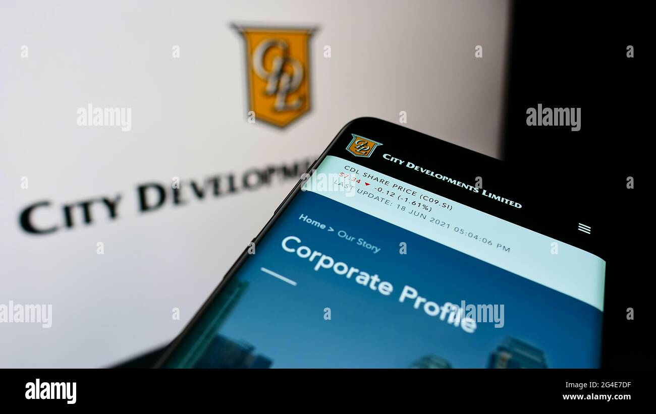 Mobile phone with webpage of Singaporean property company City Developments Limited on screen in ...