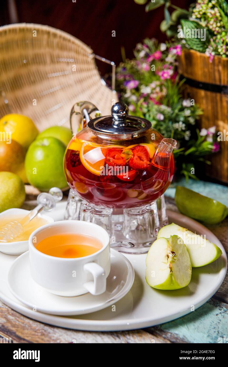 red fruit tea in a transparent teapot at the tea party ceremony Stock ...