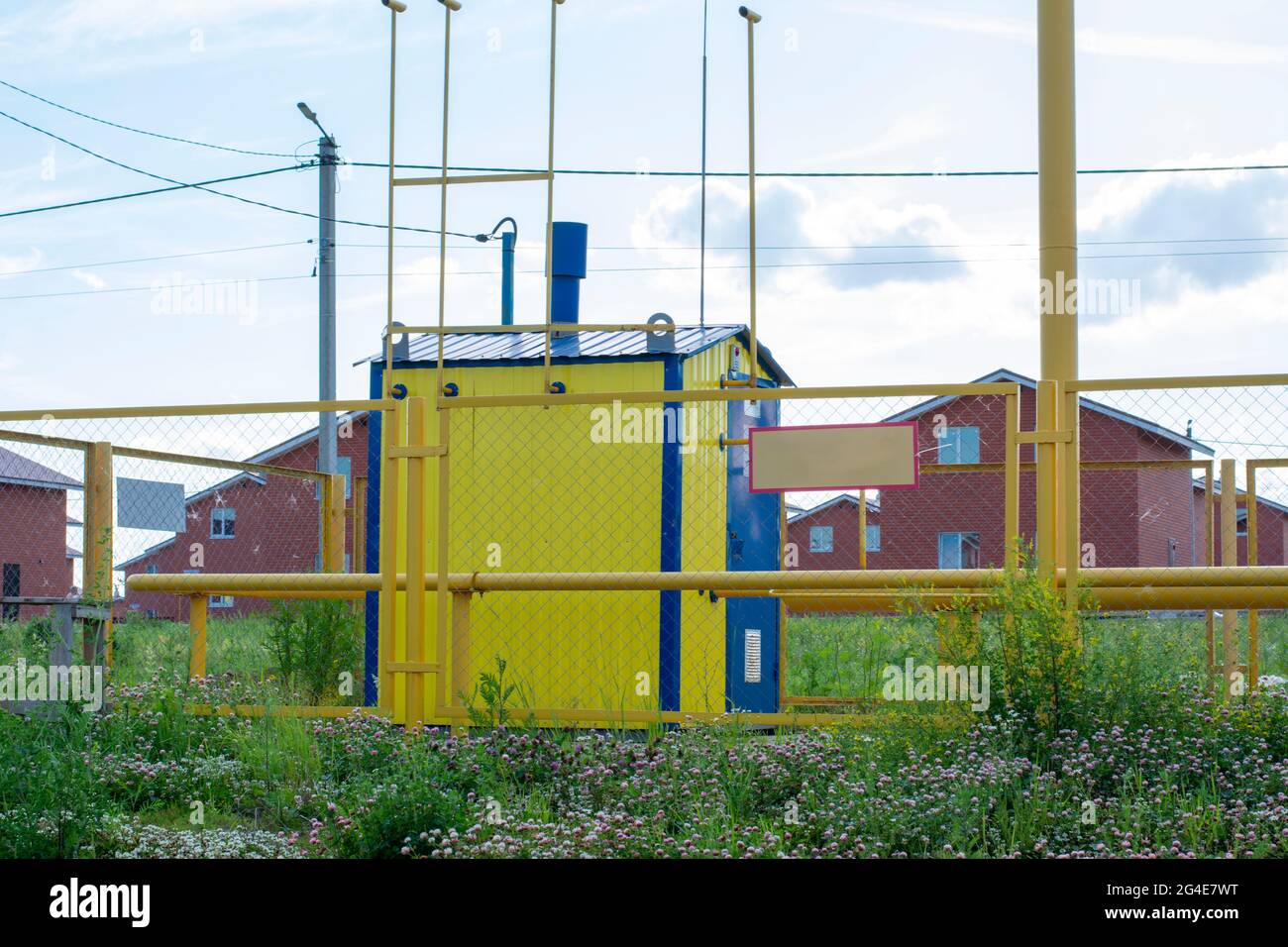 Yellow booth with gas and pipes Stock Photo - Alamy