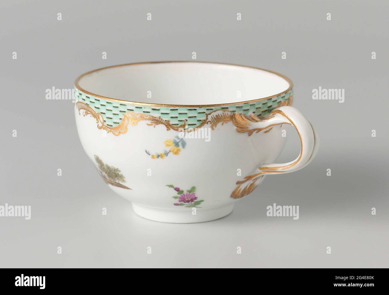 . Low cup with ear, painted porcelain. The head is painted with ...