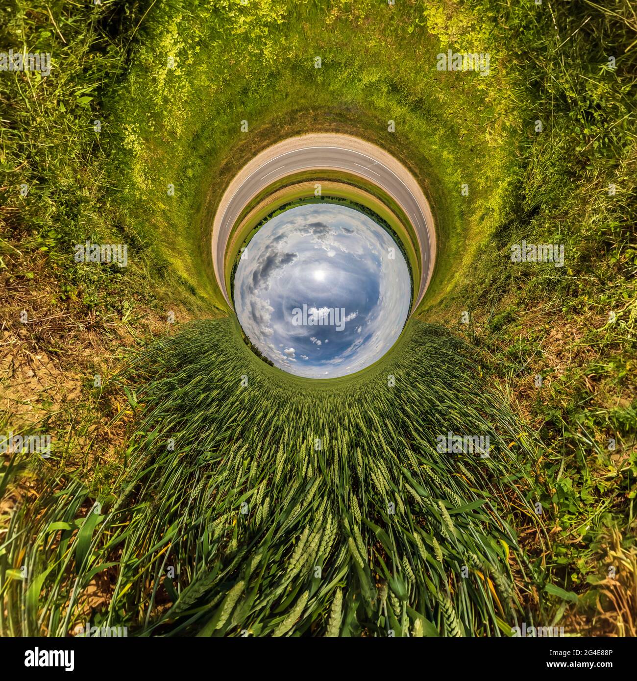 blue sky ball in middle of swirling sand road. Inversion of tiny planet ...