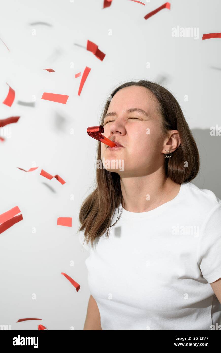 Red party blower hi-res stock photography and images - Alamy