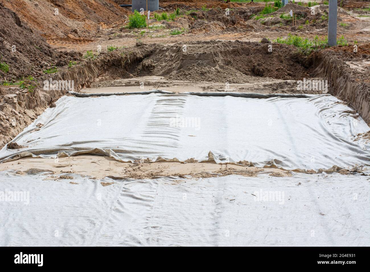 Repair construction of an asphalt road. A long road made of stones for ...