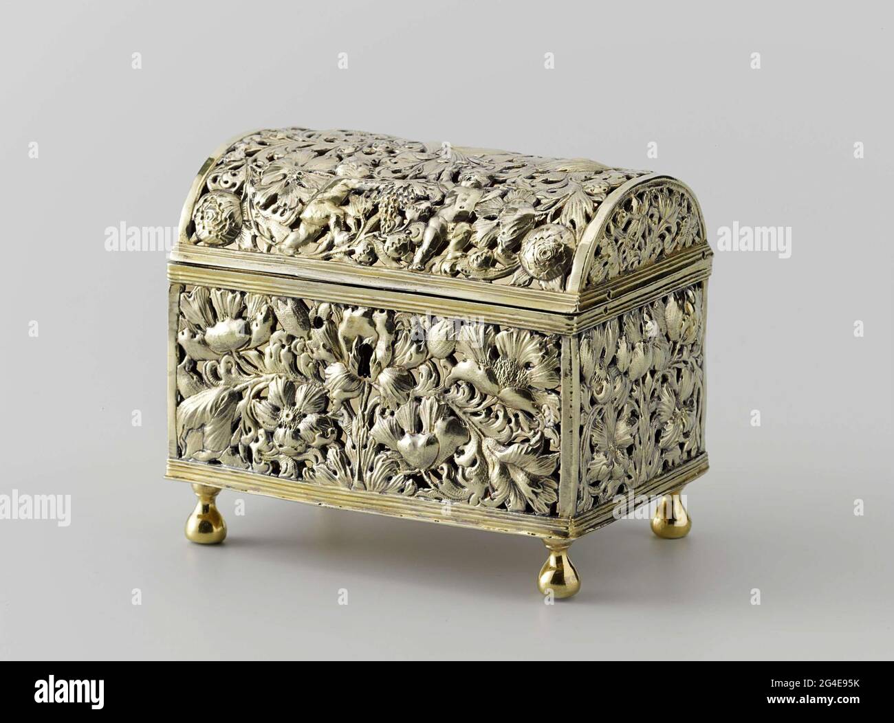 . The rectangular coffin has a broofed, hinged lid and rest on four ...