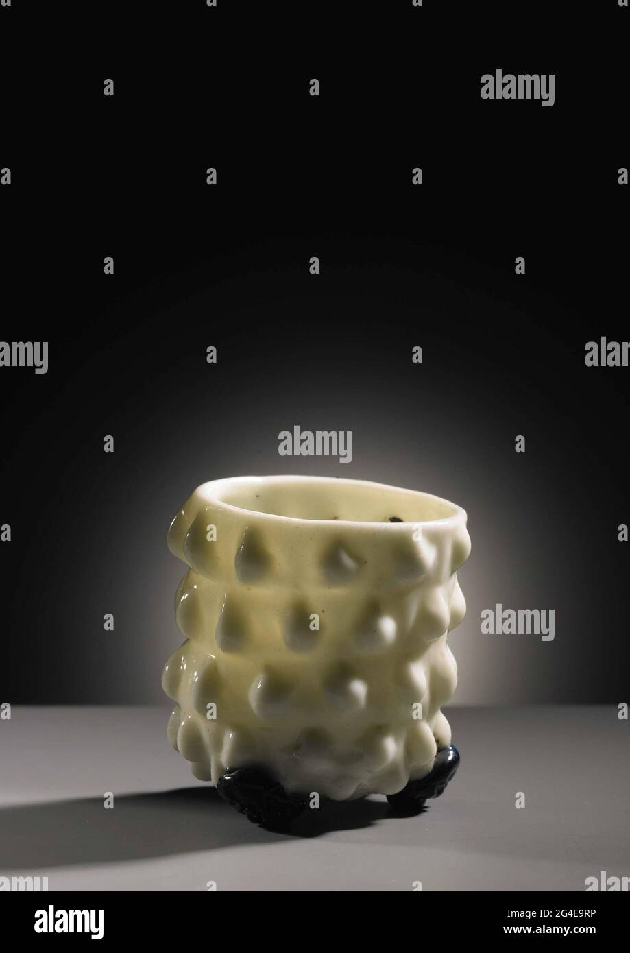 . Small knob cup of oprake white glass with inserted bottom ...